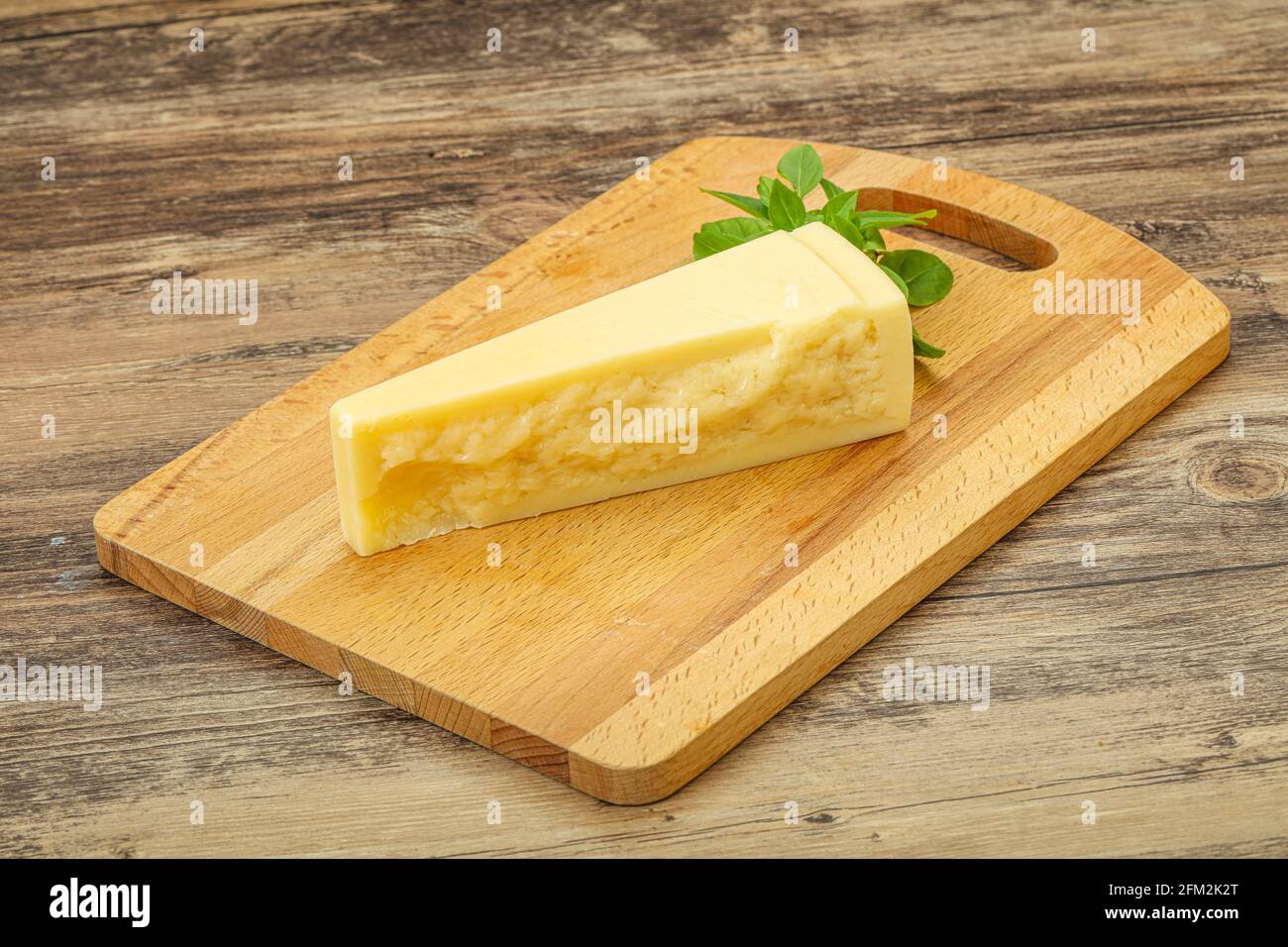 Hard parmesan cheese served basil leaves Stock Photo - Alamy
