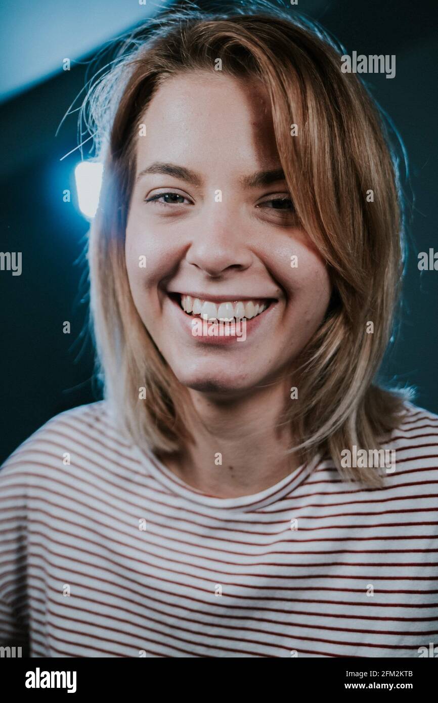 Cute laughing blonde female Stock Photo - Alamy
