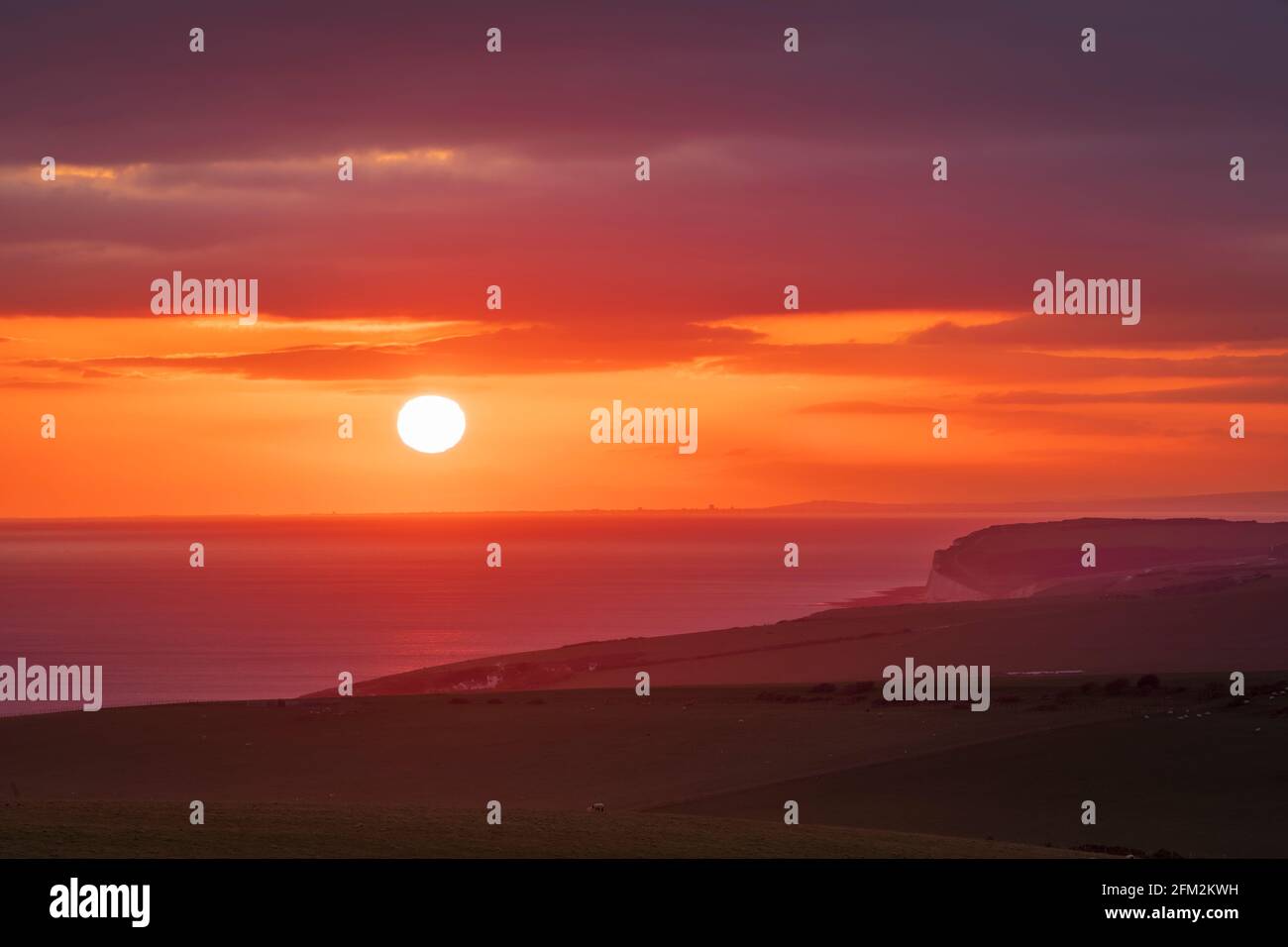 April sunset out to sea from Beachy Head on the South Downs East Sussex ...