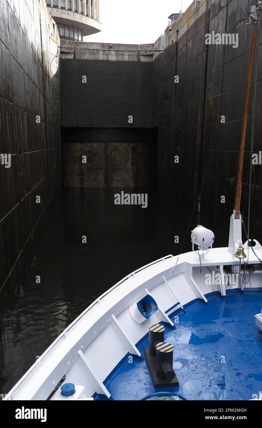 River cruise ship descending in the lock, Dnieper Hydroelectric Station ...