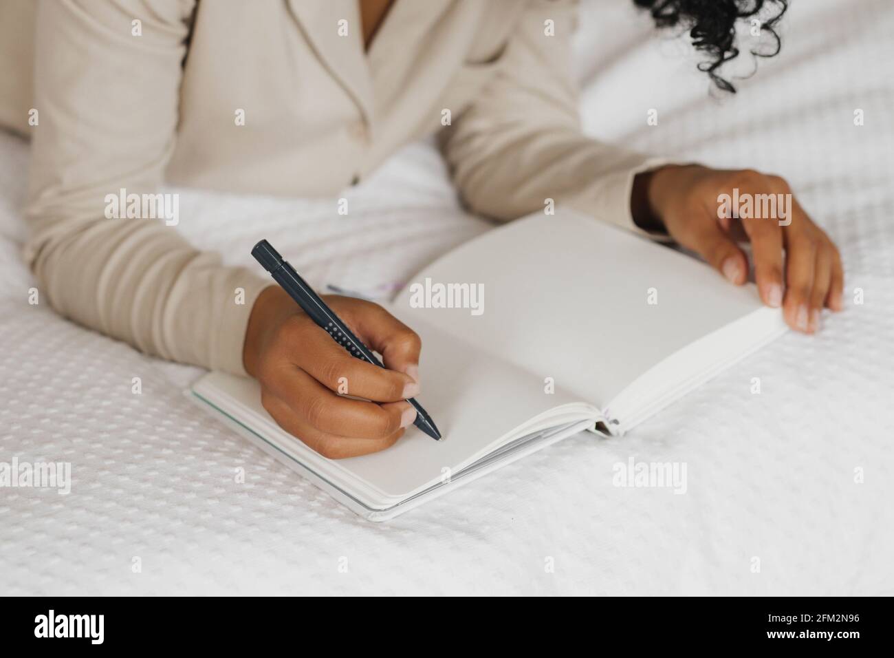 Woman writing diary bed hi-res stock photography and images - Alamy