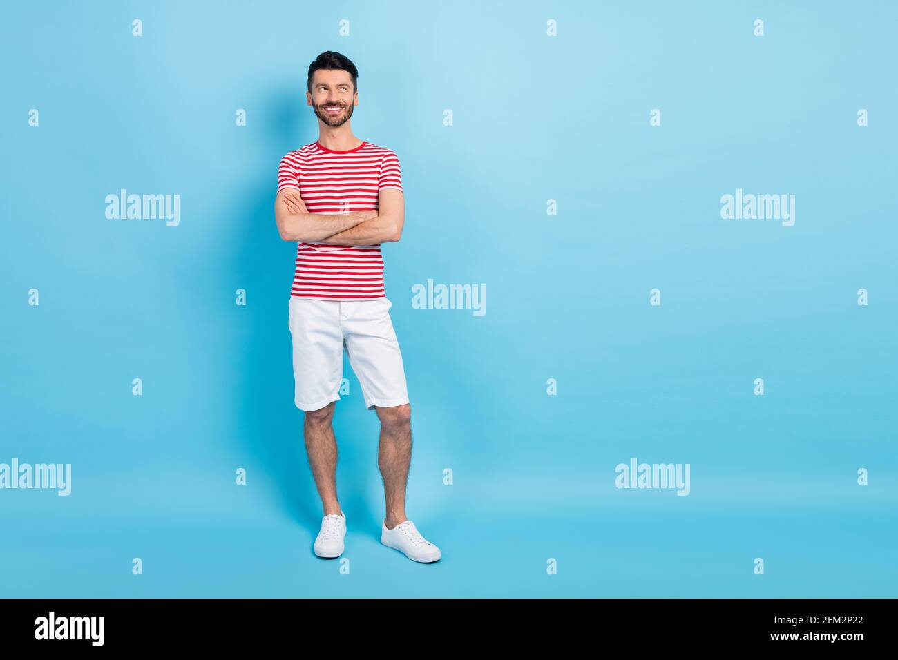 Full body photo of dreamy happy young man look empty space hold hands ...