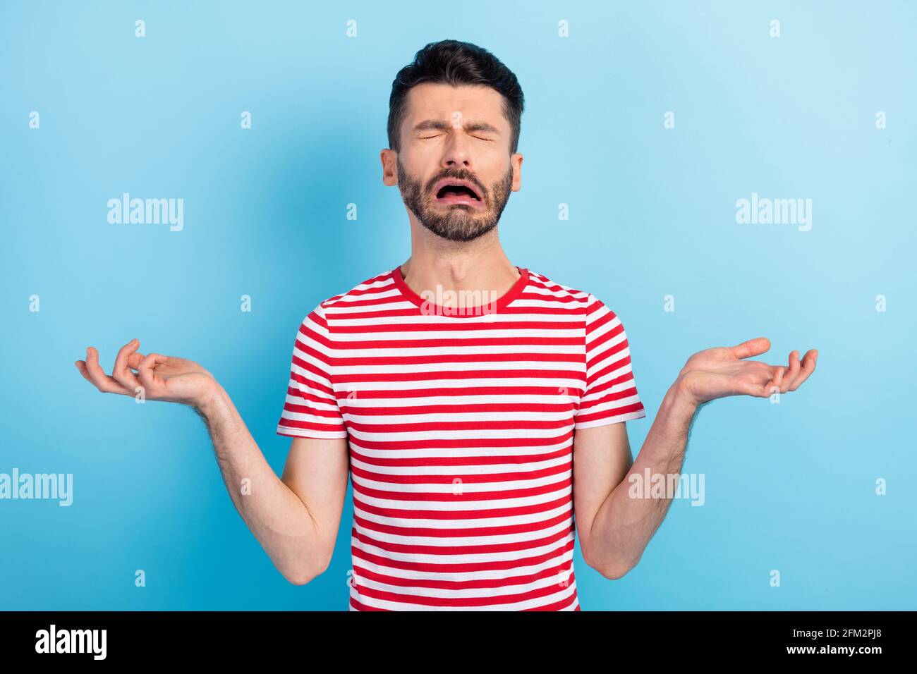 Photo of sad young man raise hands frustrated problem cry tears ...