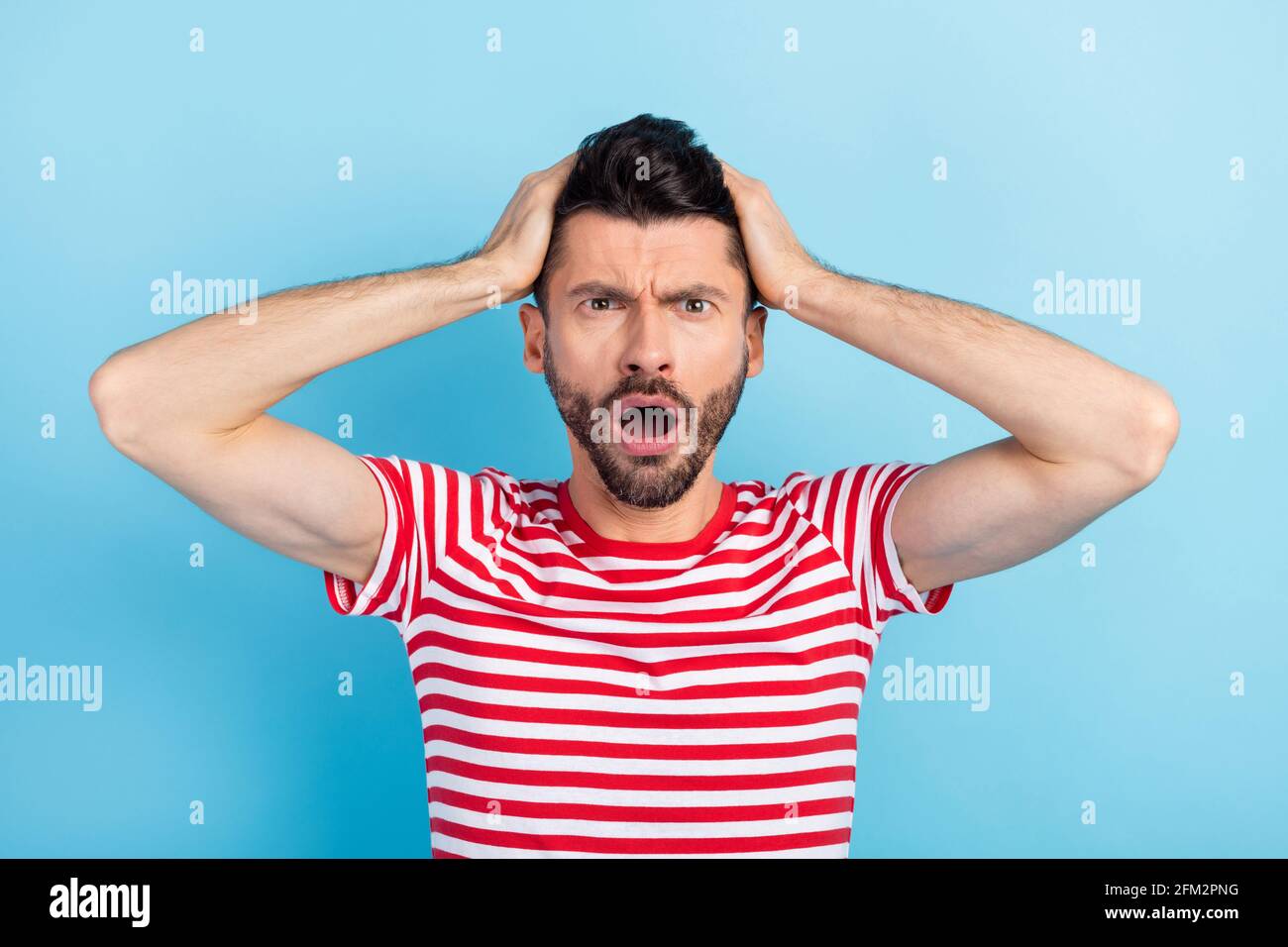 Photo of shocked unhappy young man hold hands head bad mood news ...