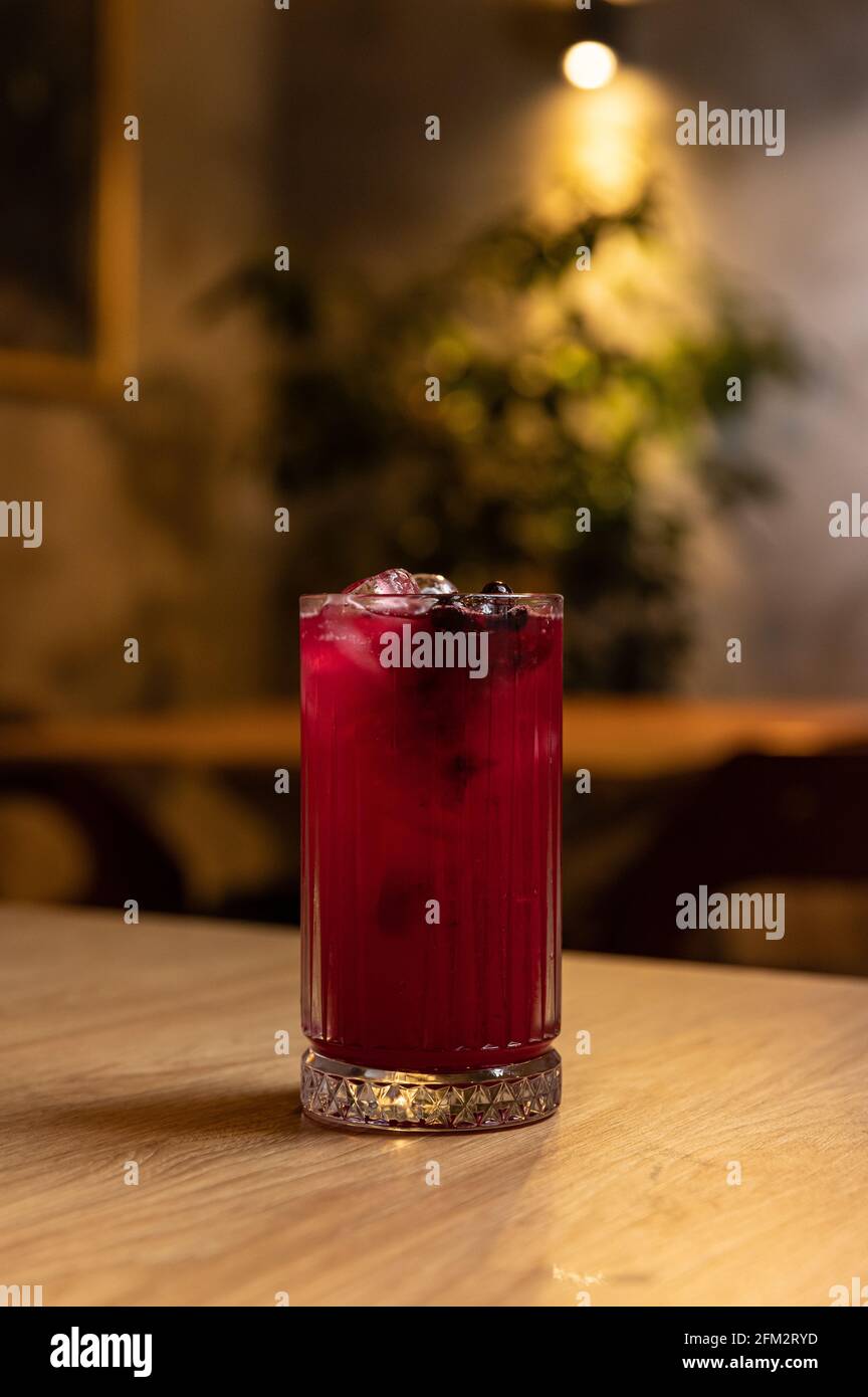 Cold refreshing drink with blueberries and ice on a restaurant table ...