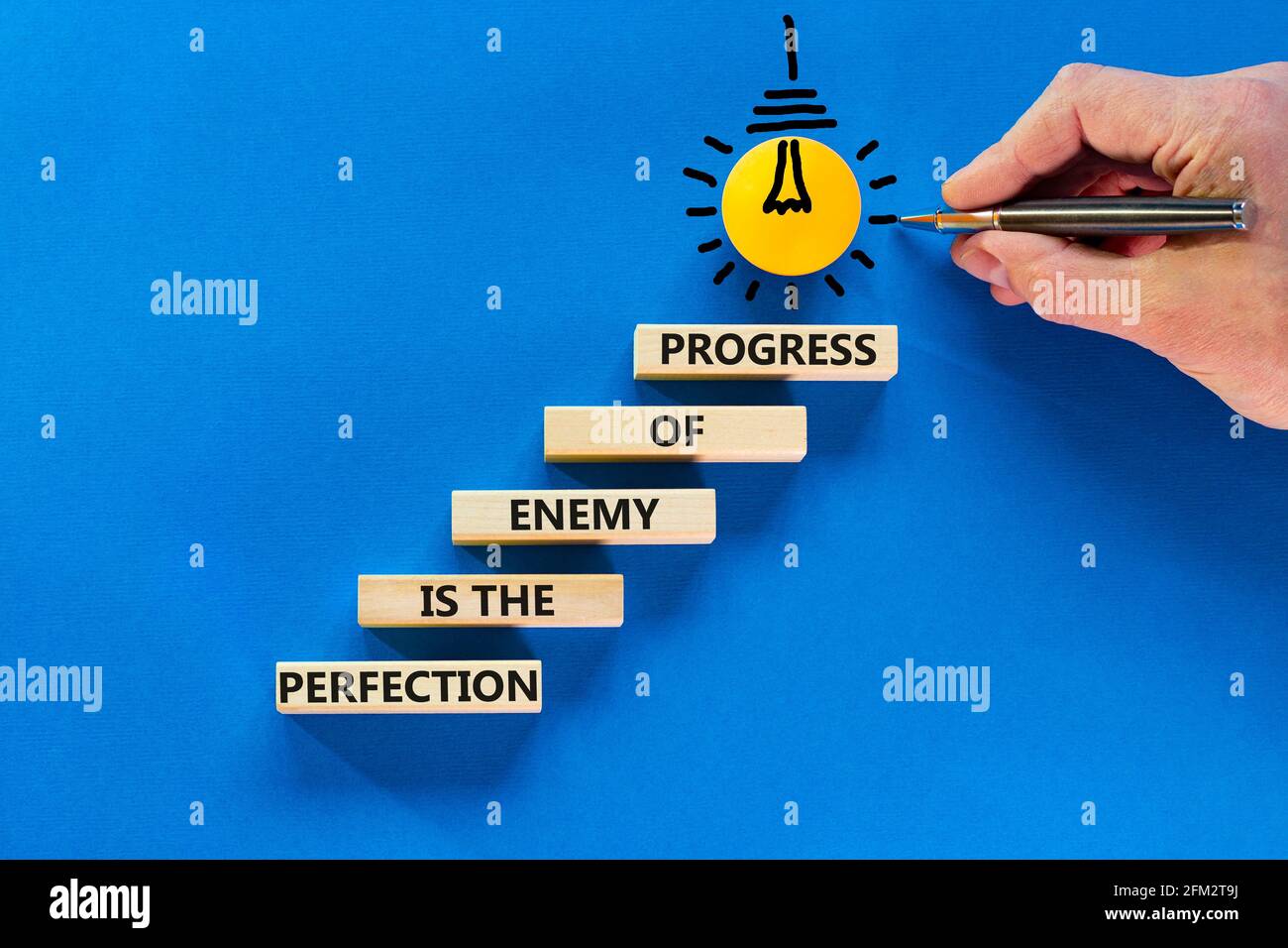 Perfection or progress symbol. Wooden blocks on blue background, copy ...