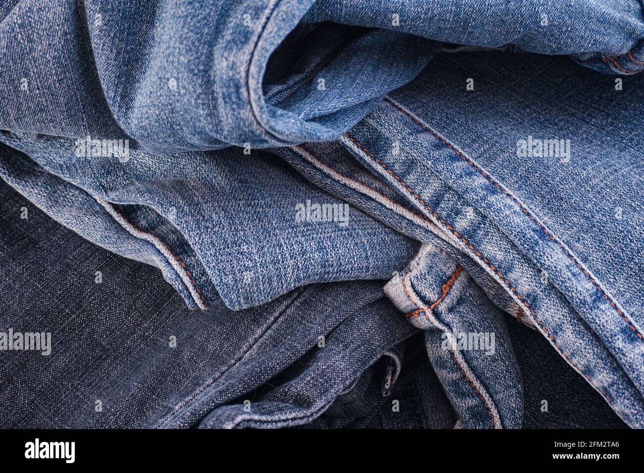 A crumpled denim jeans background. Close up Stock Photo - Alamy