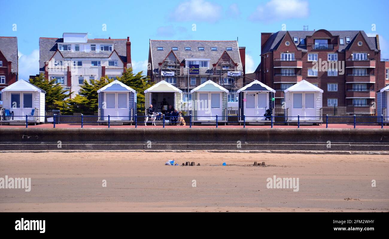A group of people enjoy the sunshine at a beach hut at St Annes On Sea ...