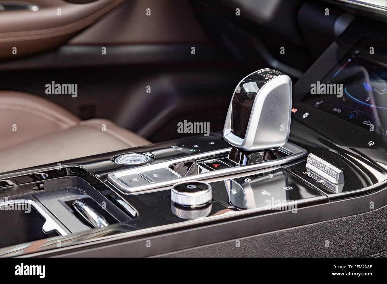 close-up of an automatic transmission knob in a new modern car. side ...
