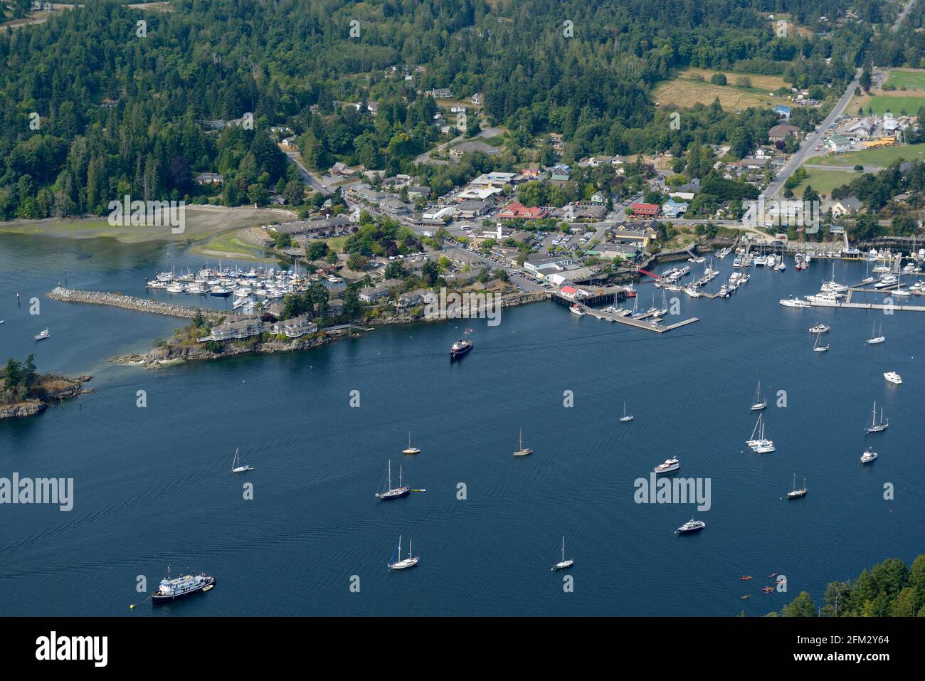 Aerial photograph of boats at anchor in front of the town of Ganges ...