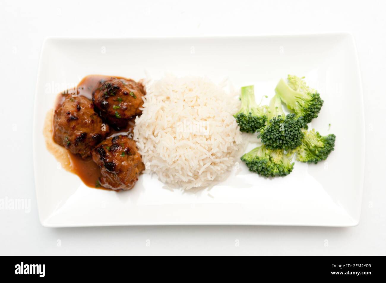 honey garlic meatballs with white rice Stock Photo - Alamy