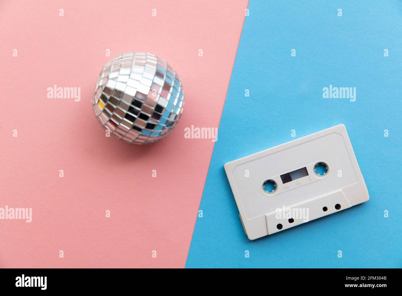 Retro disco glitter ball with a vintage cassette tape Stock Photo - Alamy
