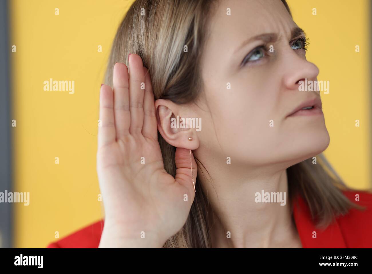 Woman holds ears hi-res stock photography and images - Alamy