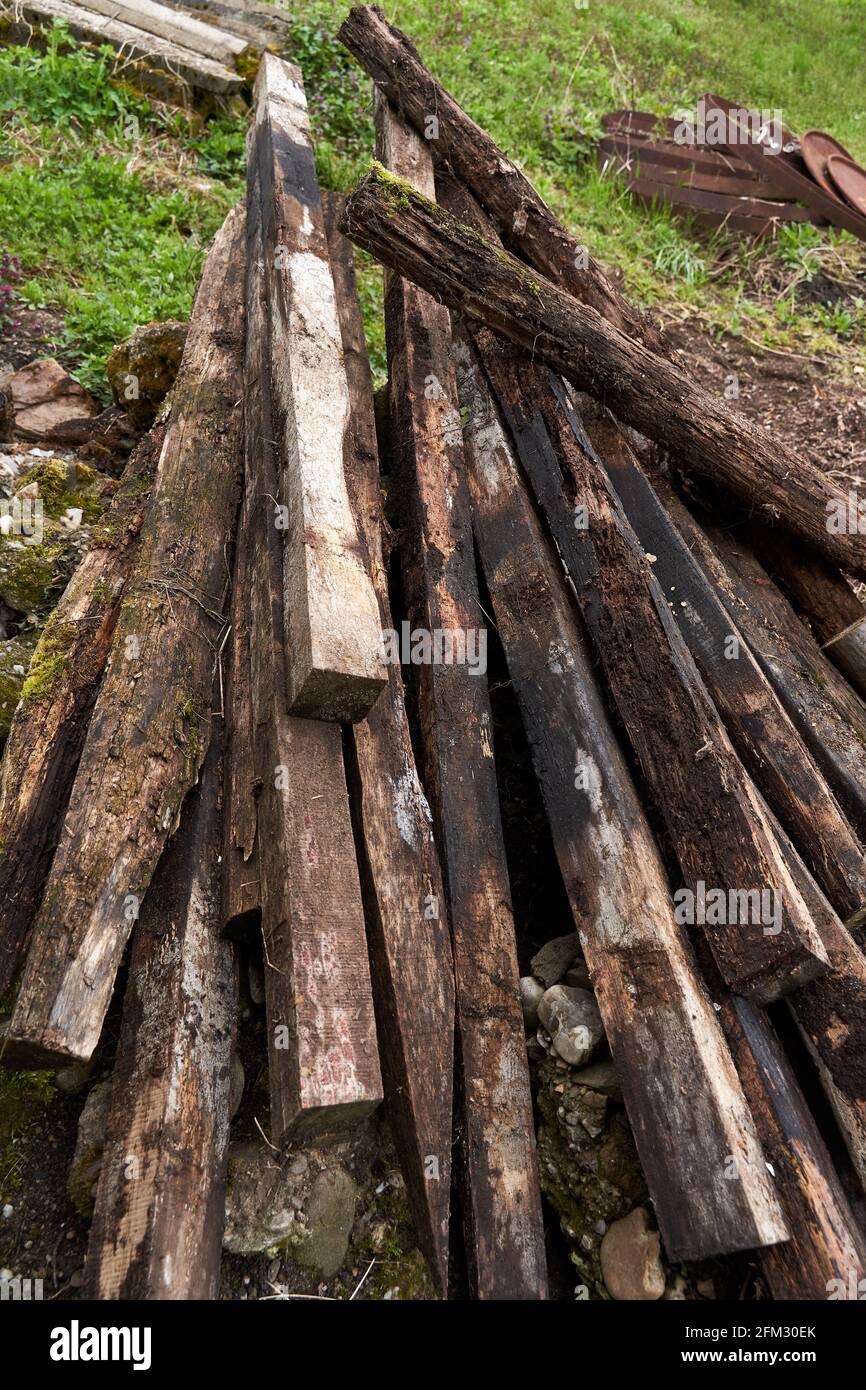 Rotten and burnt wood beams at a construction site Stock Photo - Alamy