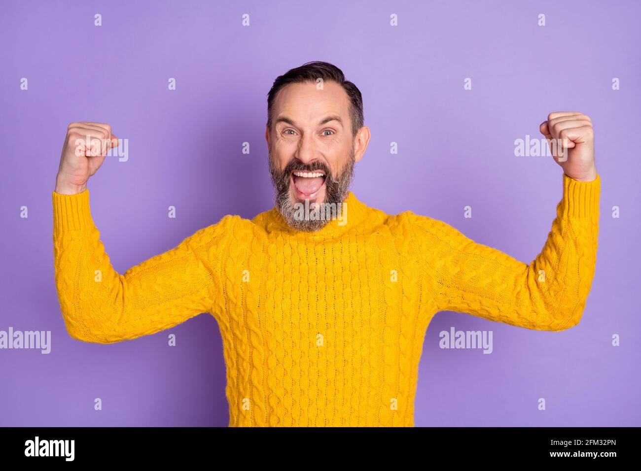 Photo of crazy strong man raise two hands show muscles wear yellow ...
