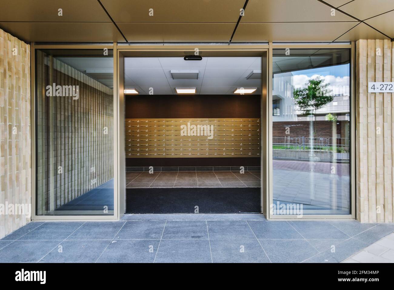 Opened door of apartment building Stock Photo - Alamy