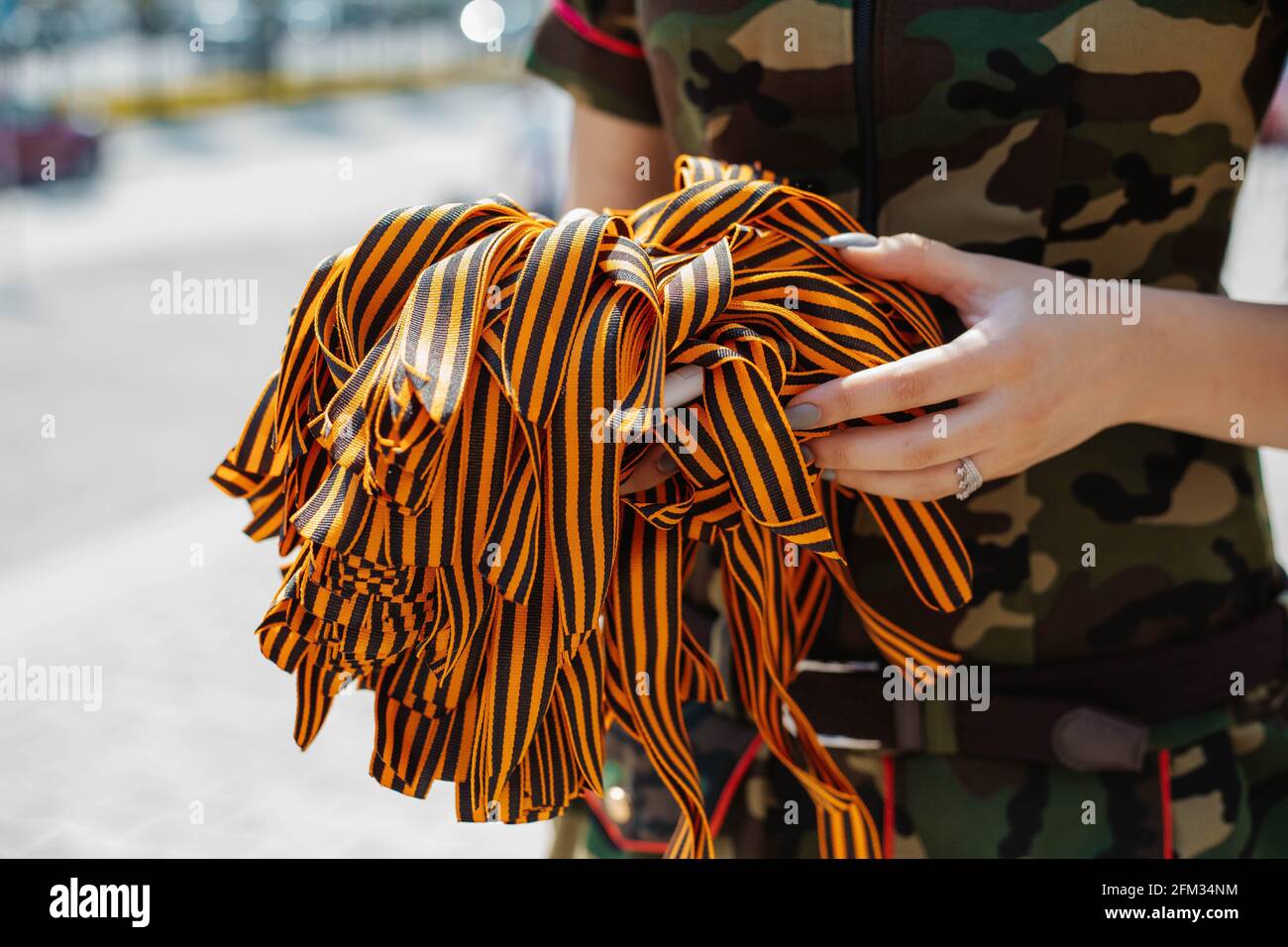 georgian ribbon from hand to hand people Stock Photo - Alamy