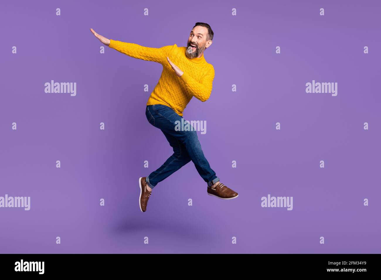 Full body profile portrait of energetic man look empty space arms ...