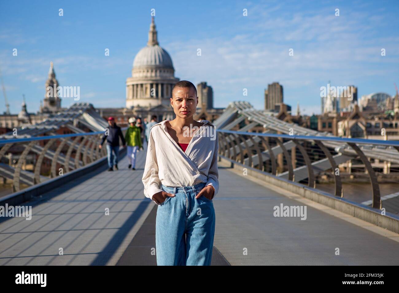 A model wearing a white shirt and Jeans, Reebok trainers during a ...