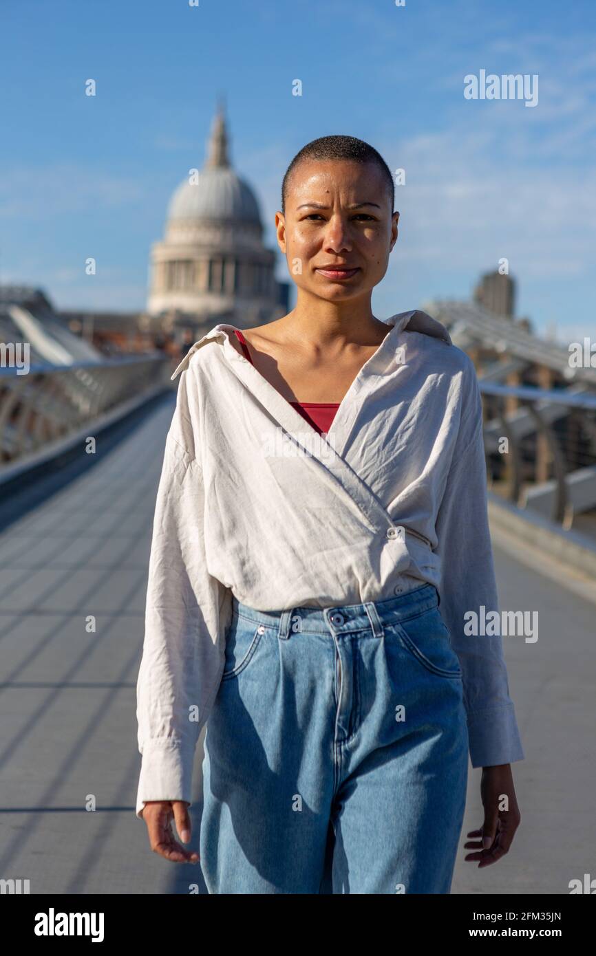 A model wearing a white shirt and Jeans, Reebok trainers during a ...