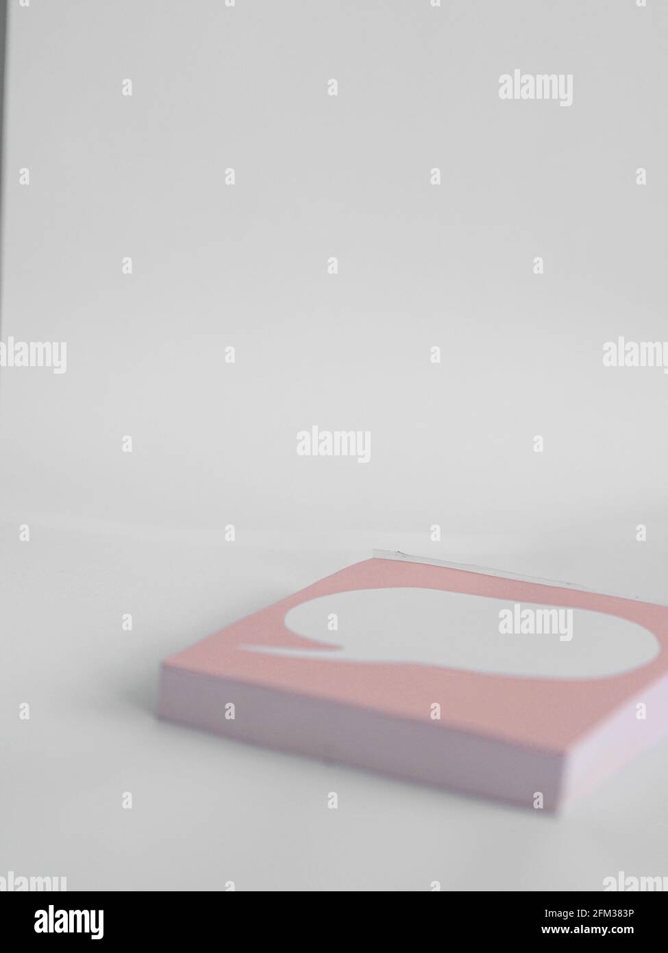 Vertical shot of a small writing pad on a white background Stock Photo ...