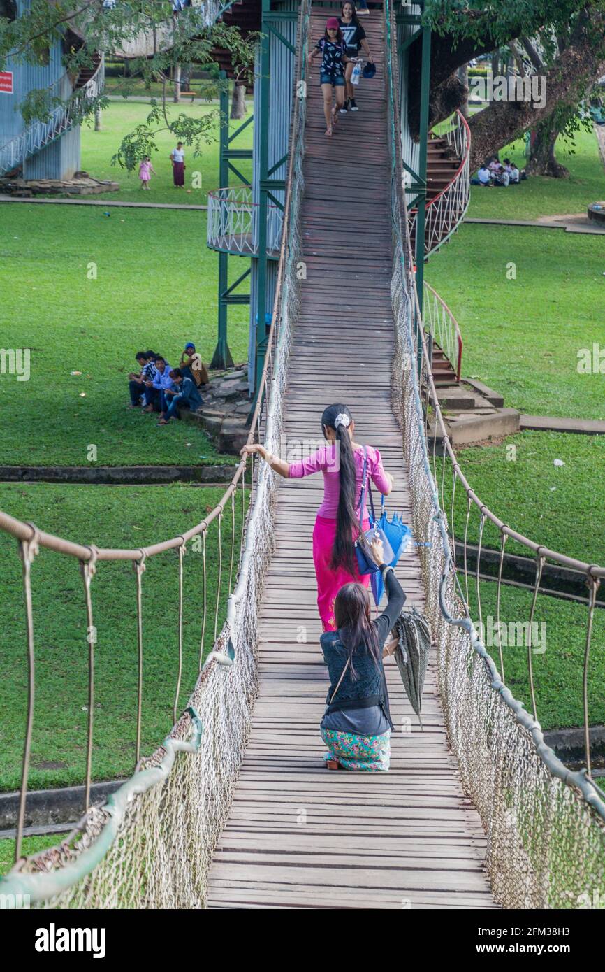 YANGON, MYANMAR - DECEMBER 16, 2016:Tree tower and suspension bridges ...