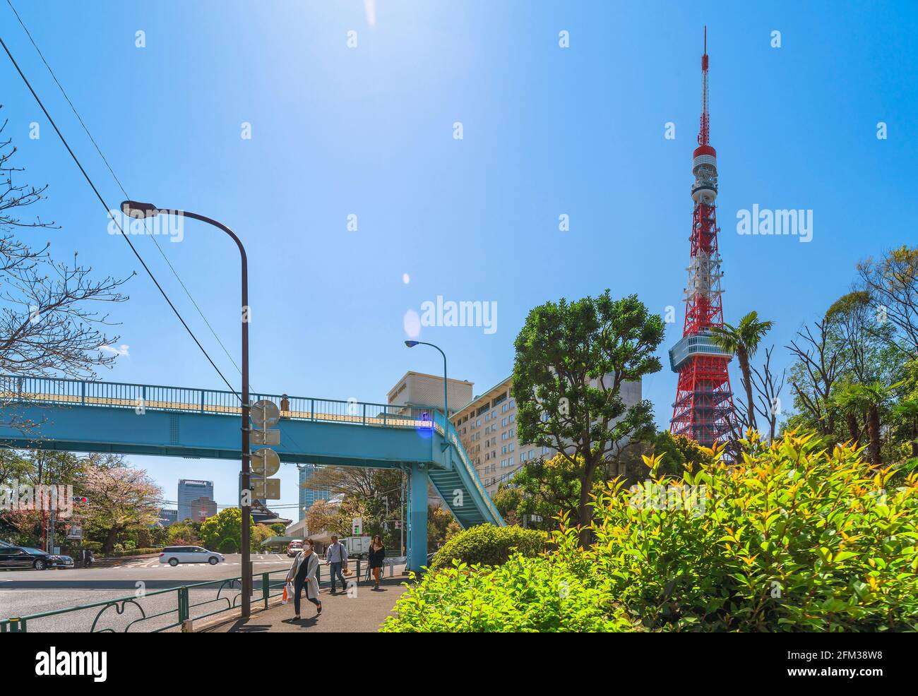 tokyo, japan - april 06 2020: Pedestrian bridge at Shiba Park crossing with the tallest lattice ...