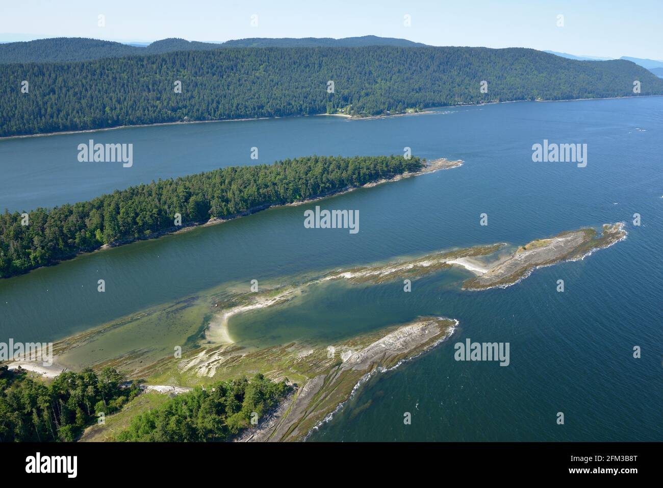 Aerial photograph of Cabbage Island and reefs with Tumbo Island and ...