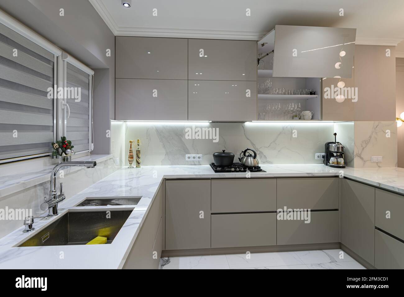 Luxury white modern marble kitchen in studio space Stock Photo - Alamy