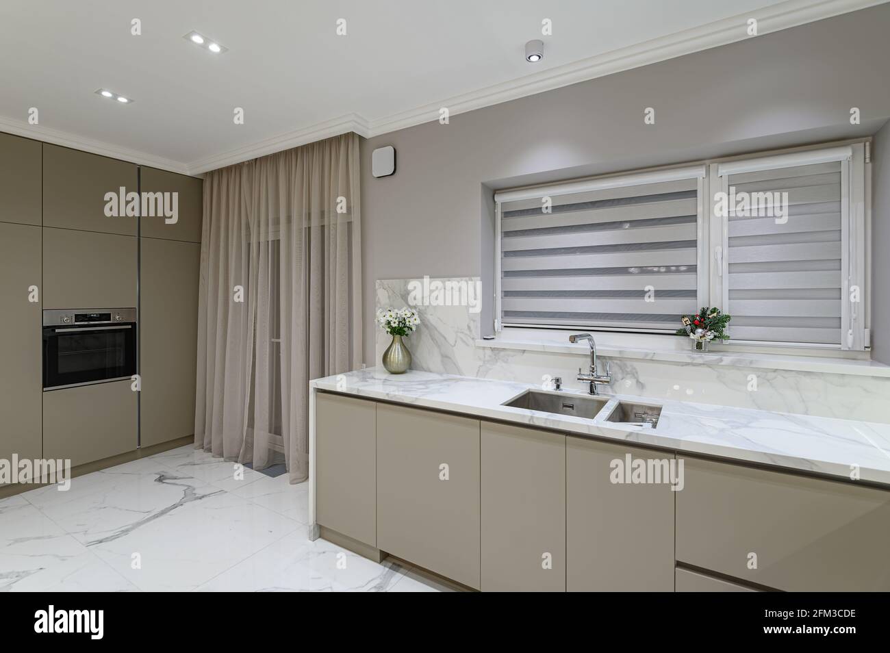 Luxury white modern marble kitchen in studio space Stock Photo - Alamy