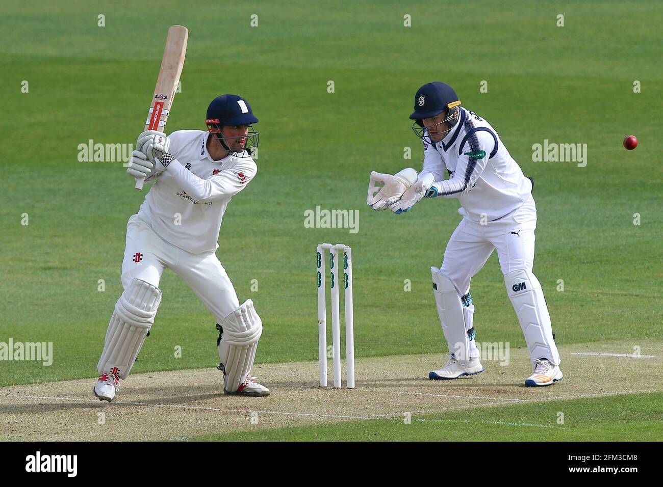 Alastair Cook in batting action for Essex as Lewis McManus looks on ...