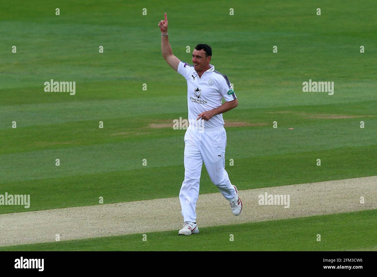 Kyle Abbott of Hampshire celebrates taking the wicket of Ravi Bopara ...