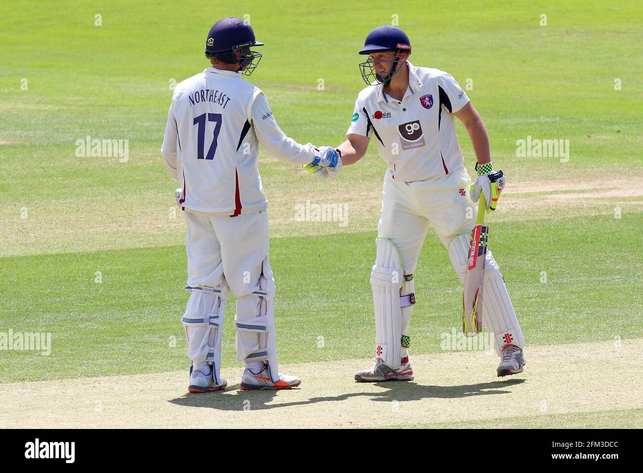 Sam Northeast (L) of Kent congratulates James Tredwell on reaching his ...