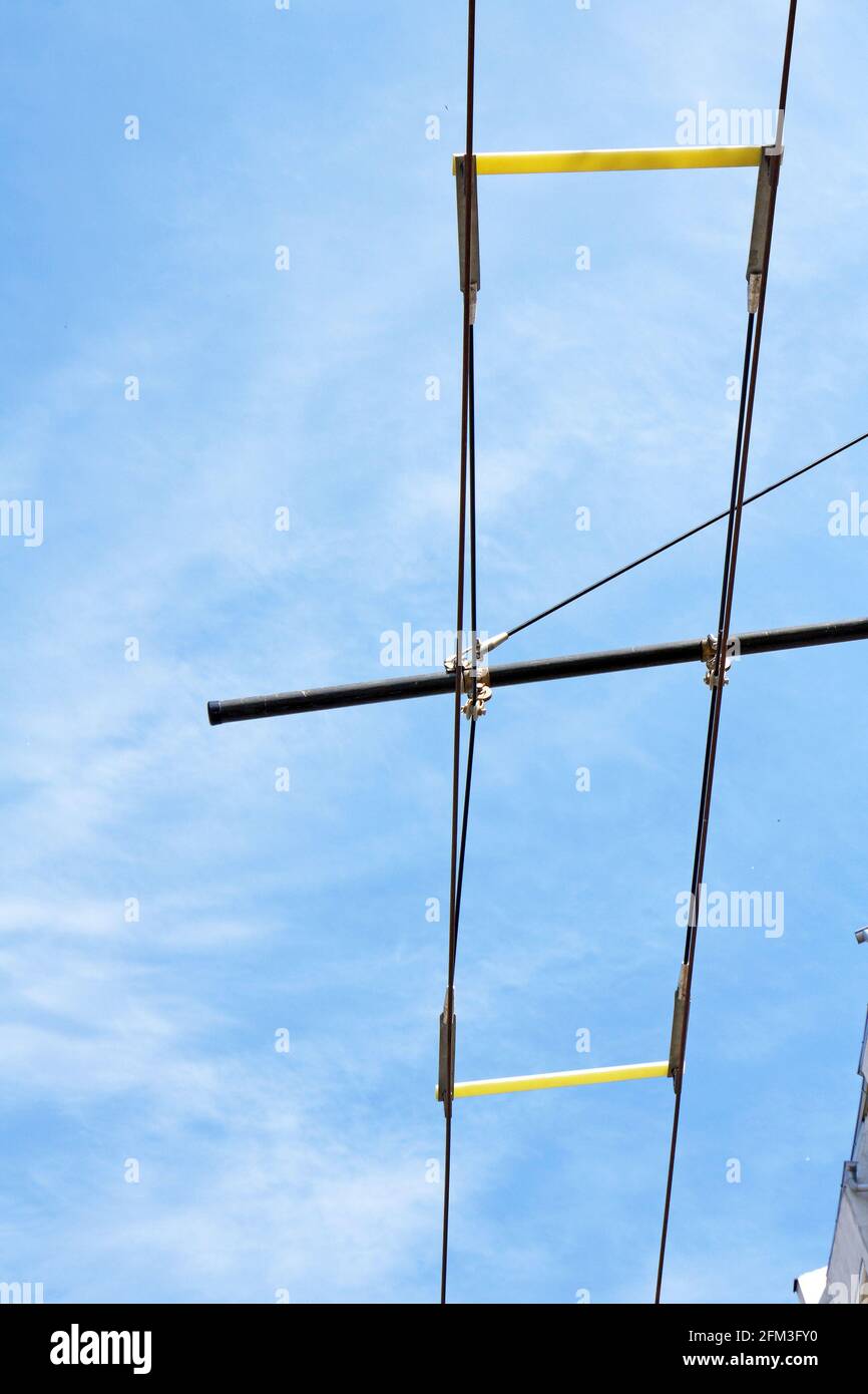 Dual powered wires on blue sky that run public trolley buses Stock ...
