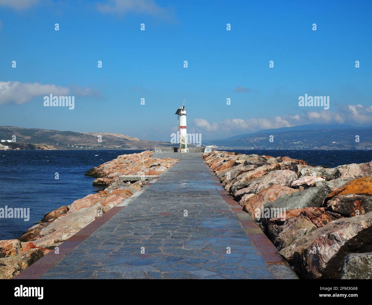 The small ligth tower in the end of the harbour wa Stock Photo - Alamy