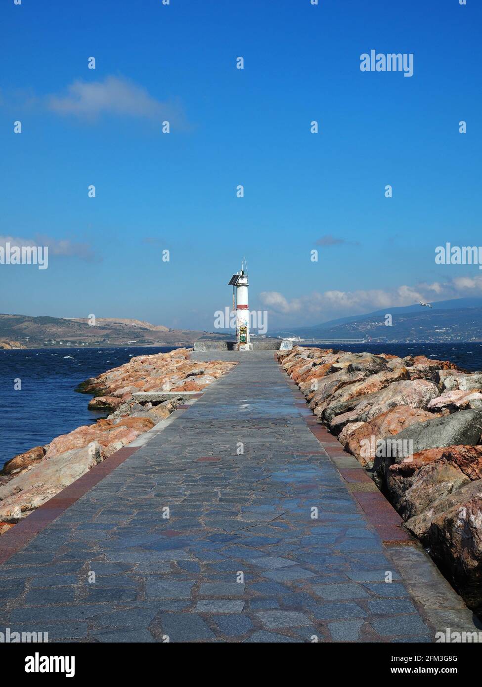 The small ligth tower in the end of the harbour wa Stock Photo - Alamy