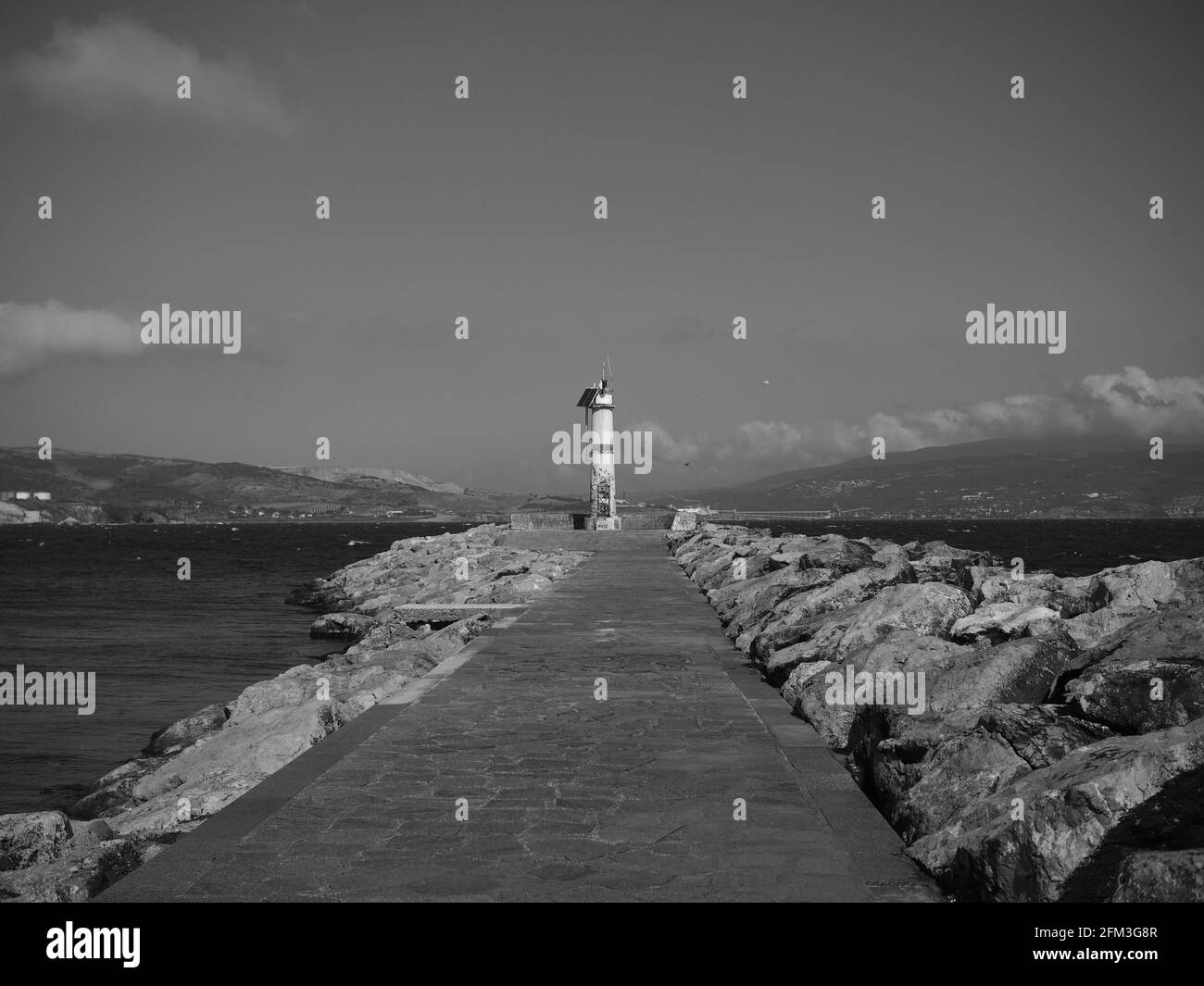 The small ligth tower in the end of the harbour wa Stock Photo - Alamy