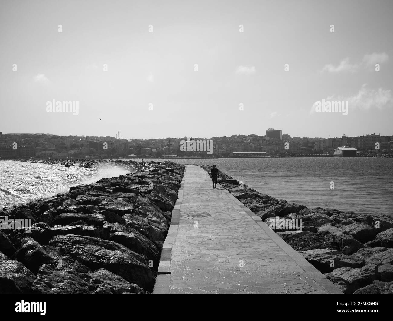 The small ligth tower in the end of the harbour way Stock Photo - Alamy