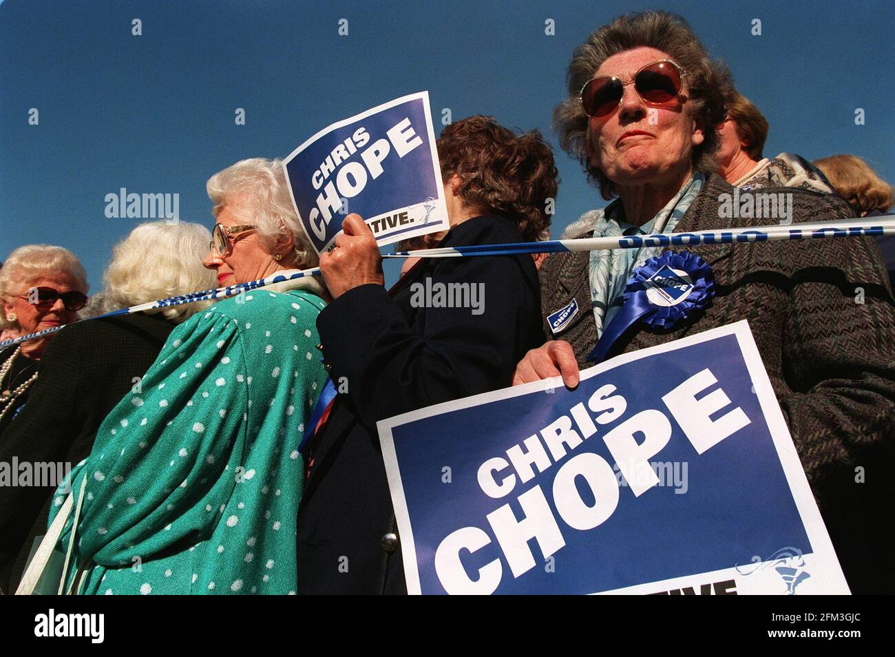 Members of the public holding Chris Chope campaign cards on Mrs ...