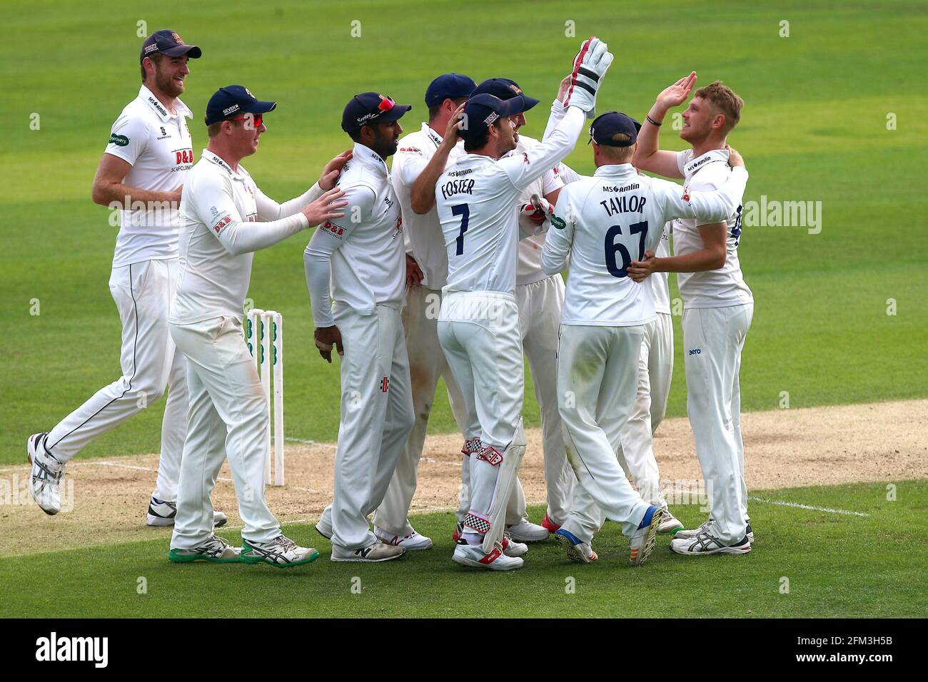 Jamie Porter of Essex celebrates taking the wicket of Ed Byrom during ...