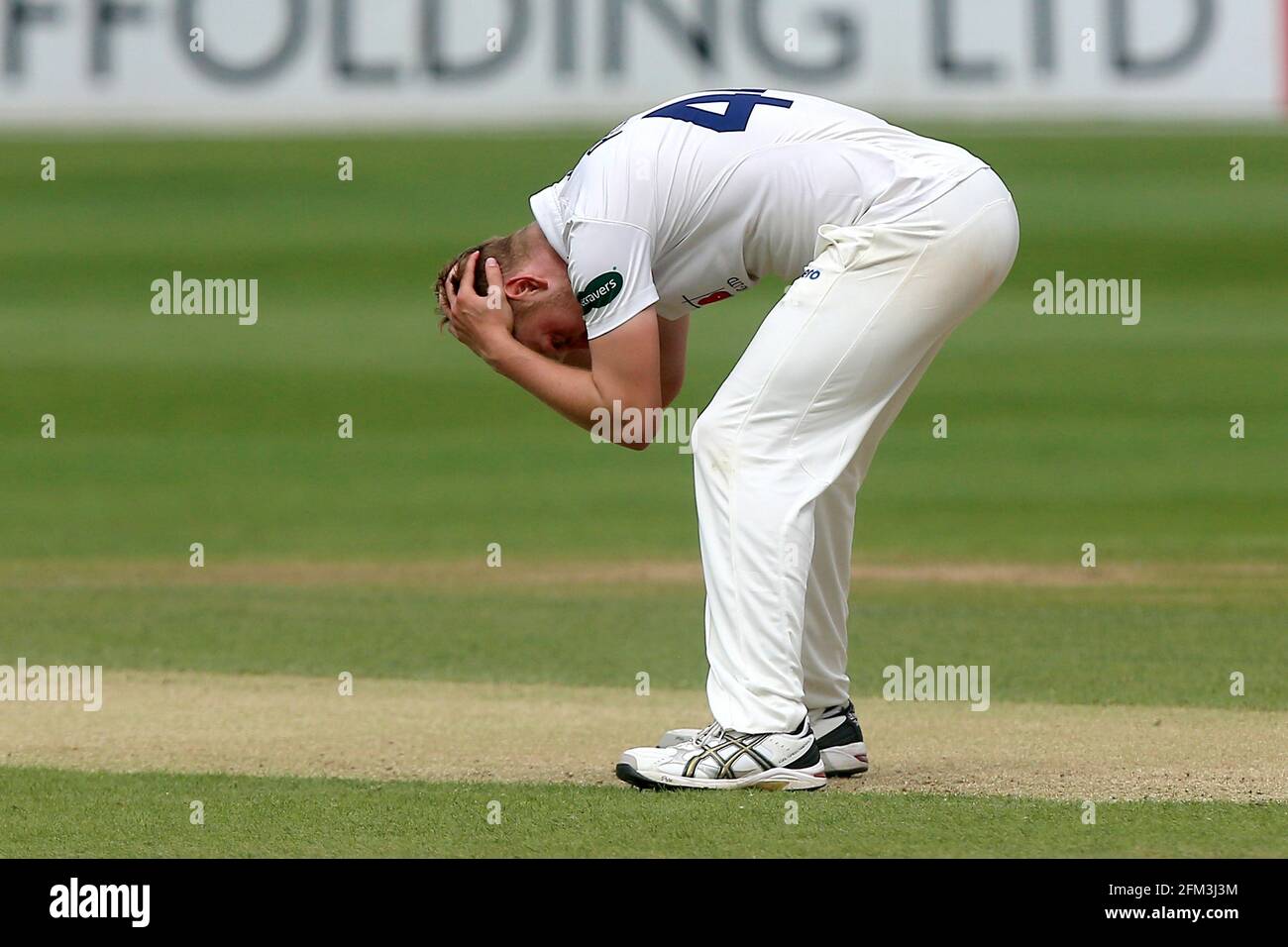 Jamie Porter of Essex reacts after a chance goes down from his bowling ...