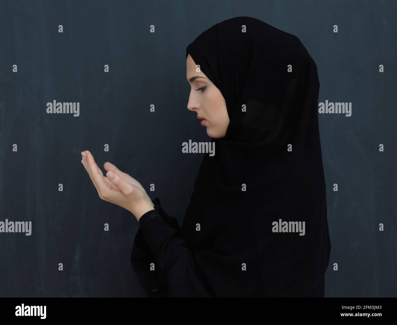 Portrait of young Muslim woman making dua Stock Photo - Alamy