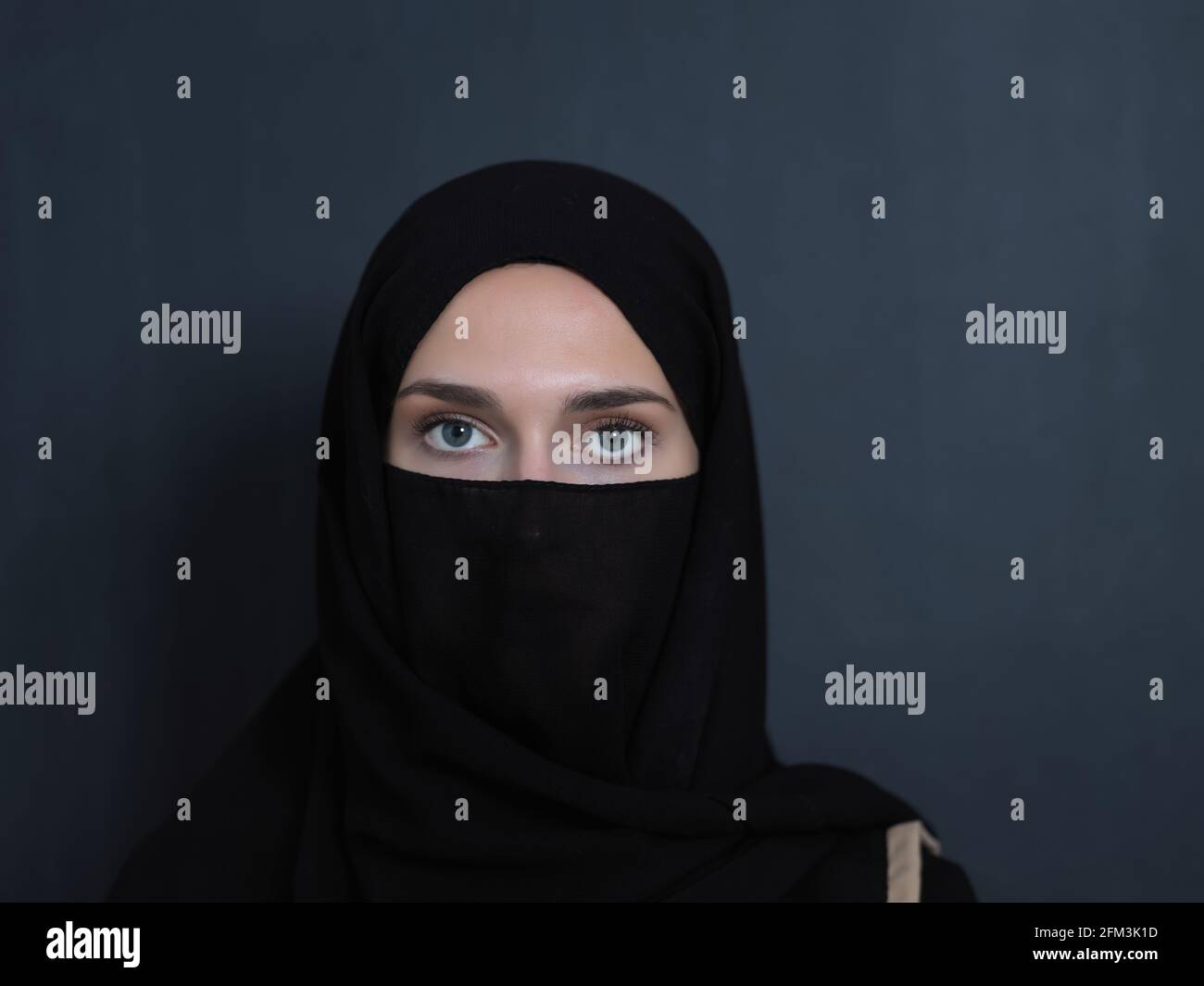 Portrait of muslim woman wearing niqab and traditional arabic clothes ...