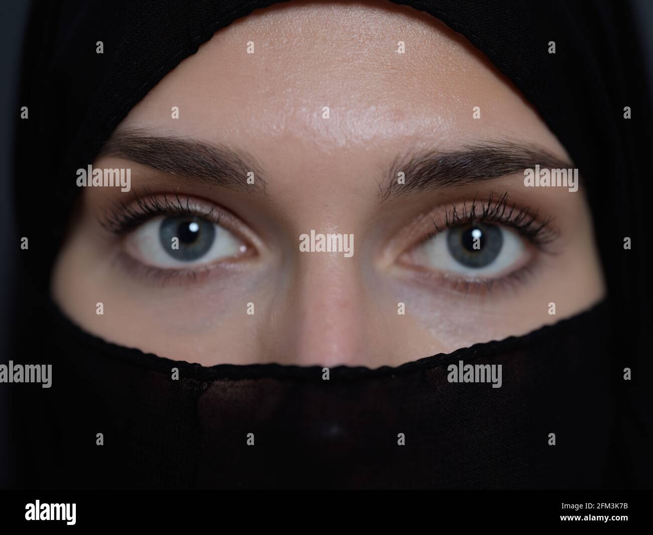 Portrait of muslim woman wearing niqab and traditional arabic clothes ...