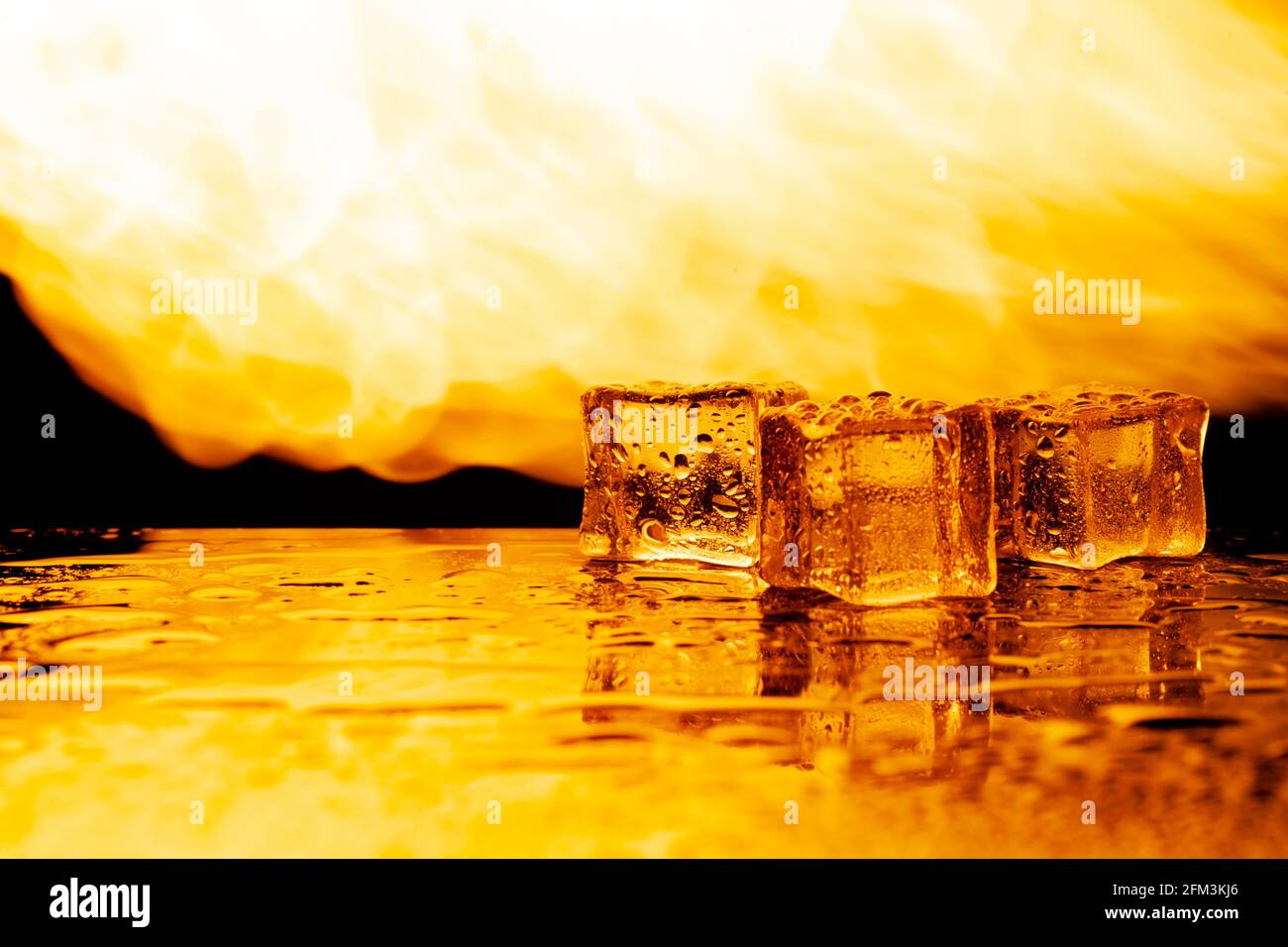 fire and ice, ice cubes and flames, black background Stock Photo - Alamy