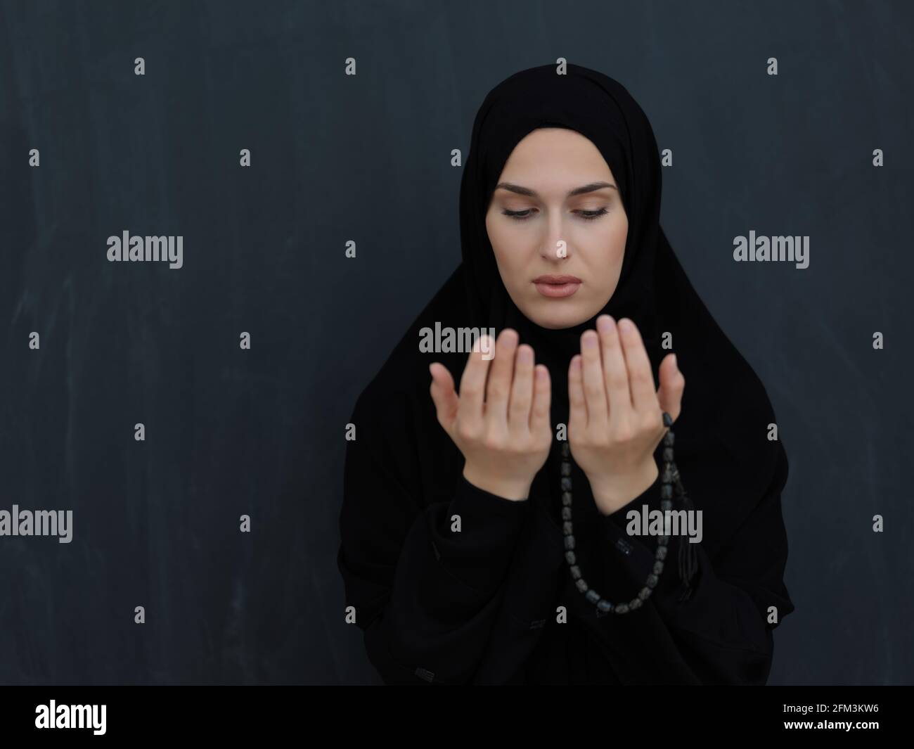 Portrait of young Muslim woman making dua Stock Photo - Alamy