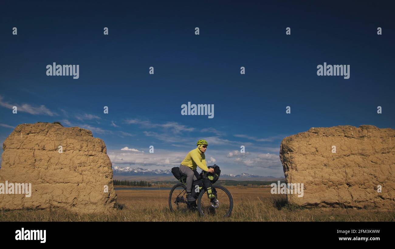 The man travel on mixed terrain cycle touring with bikepacking. The ...