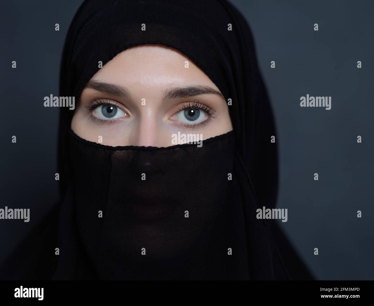 Portrait of muslim woman wearing niqab and traditional arabic clothes ...