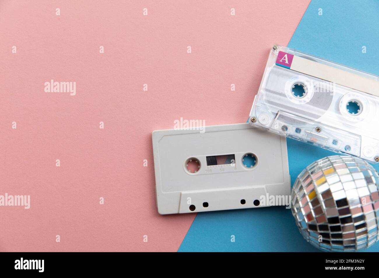 Retro disco glitter ball with a vintage cassette tape Stock Photo - Alamy