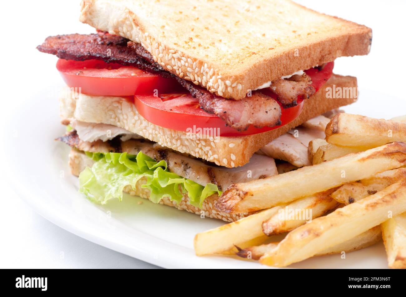 clubhouse sandwich with crispy fries Stock Photo - Alamy